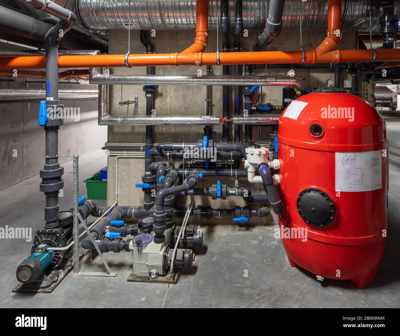 Interior of modern boiler room. Piping system. Red boiler unit Stock ...