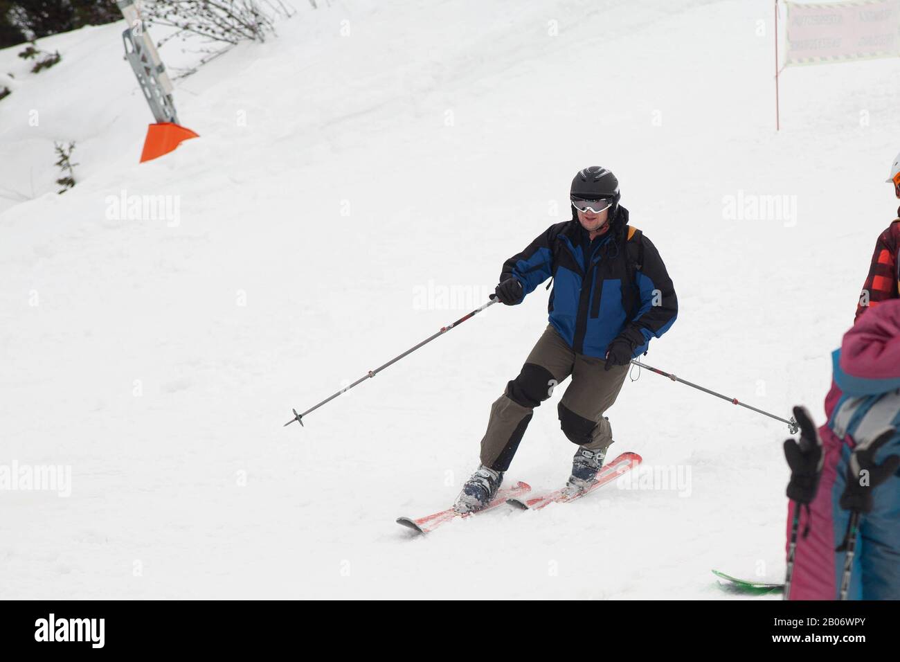 Ski resort. The skier quickly rides down a snow-covered professional ...