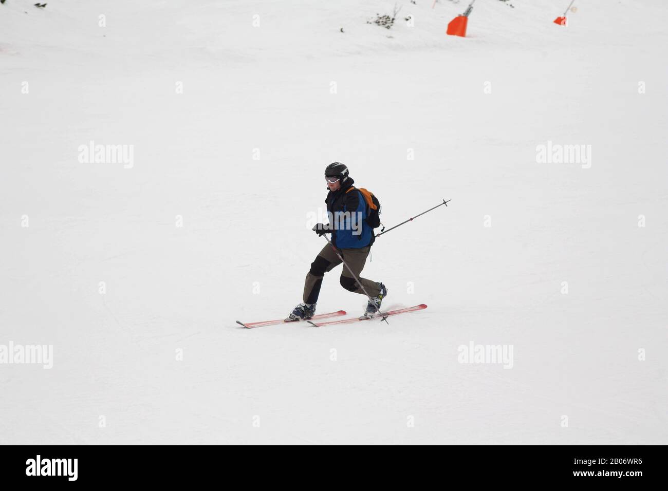 Ski resort. The skier quickly rides down a snow-covered professional ...