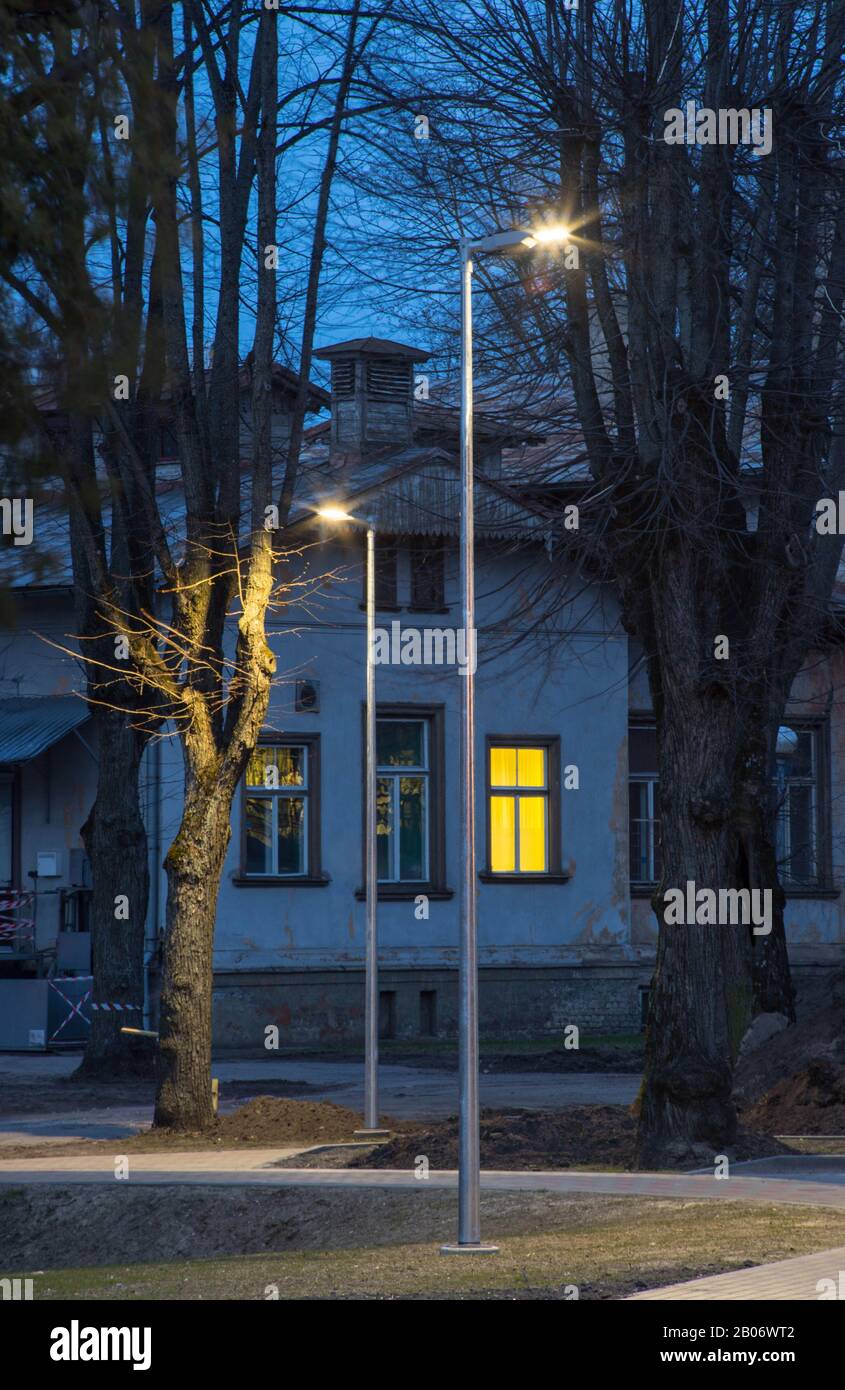 City lighting in the evening time. Residential building. Modern ...