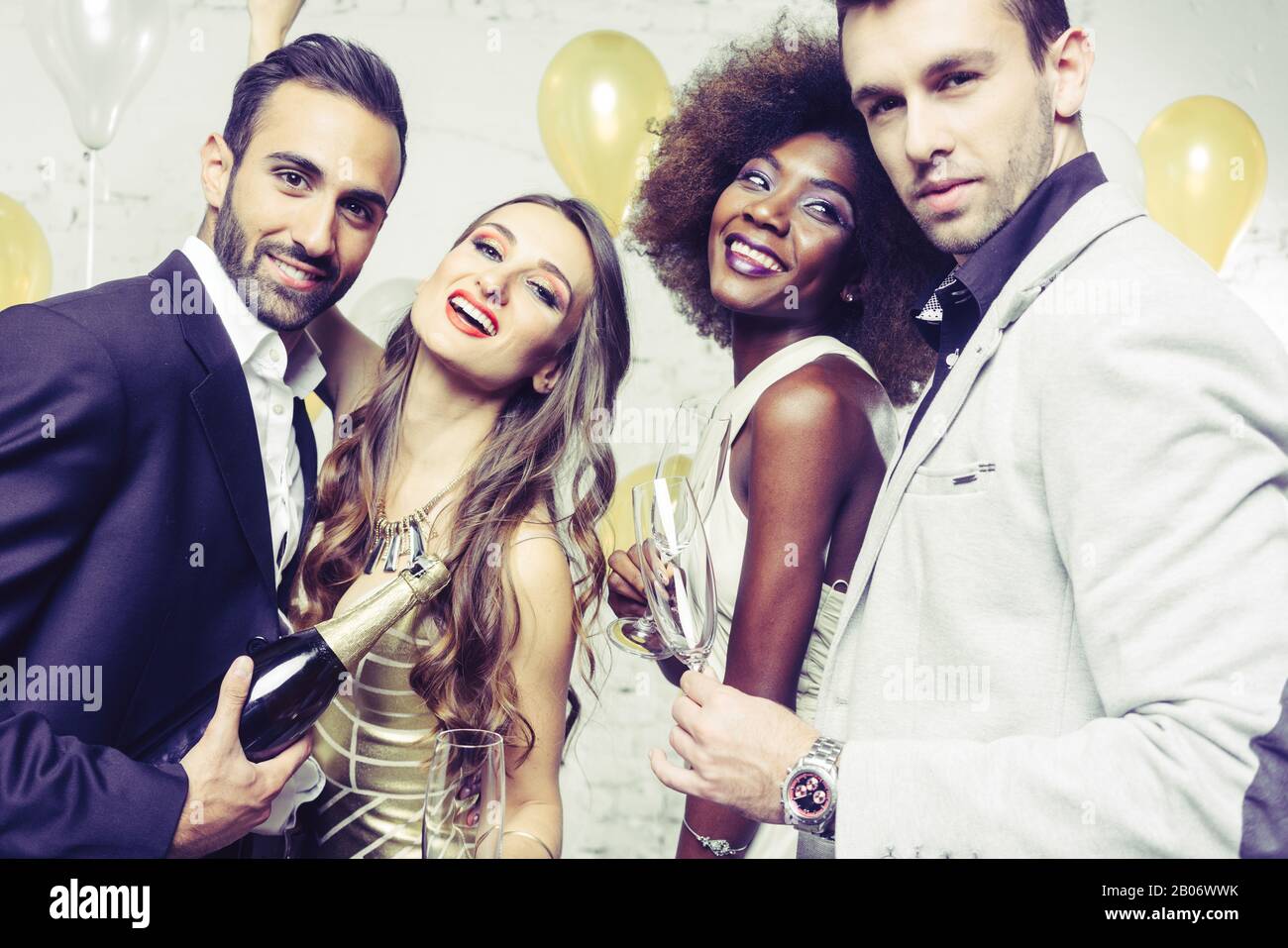 Cheerful people pouring wine glasses hi-res stock photography and ...