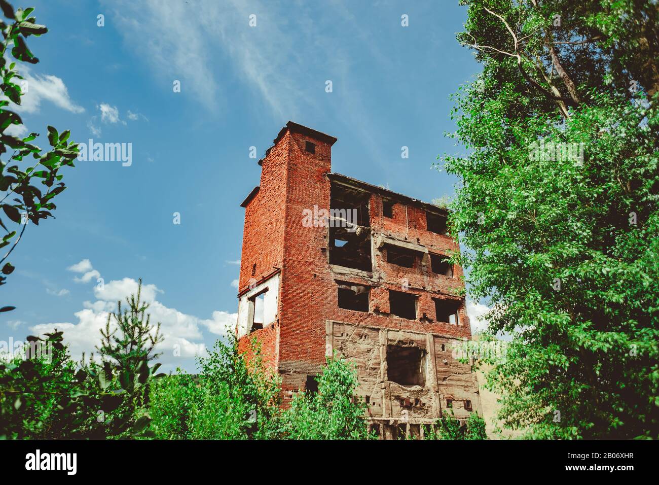 an old ruined building a tall tower against the sky Stock Photo - Alamy