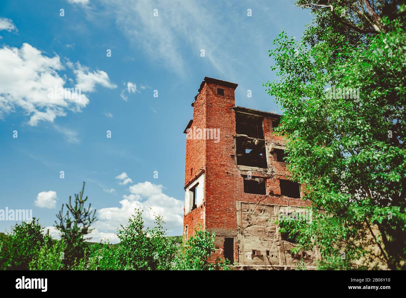 an old ruined building a tall tower against the sky Stock Photo - Alamy