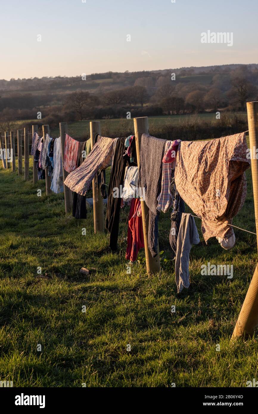 Winter washing hanging out to dry on garden fence Stock Photo - Alamy
