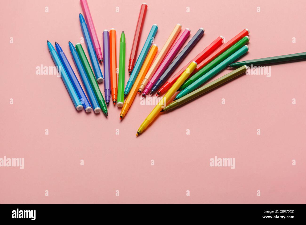 Assortment of colorful felt tip pens on pastel pink background Stock ...