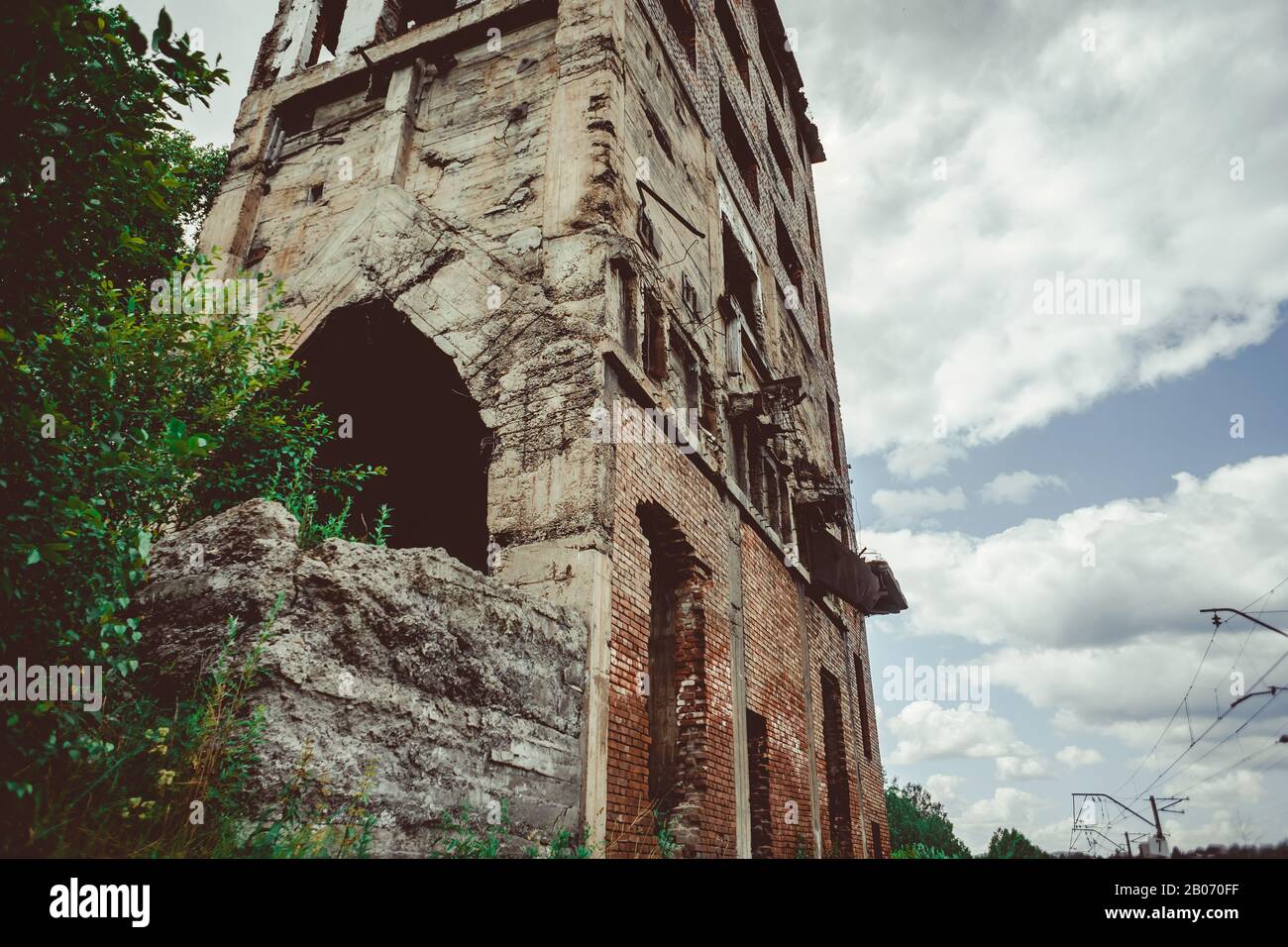 an old ruined building a tall tower against the sky Stock Photo - Alamy