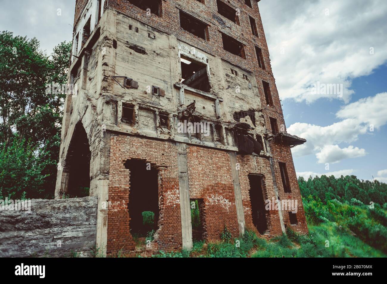 an old ruined building a tall tower against the sky Stock Photo - Alamy