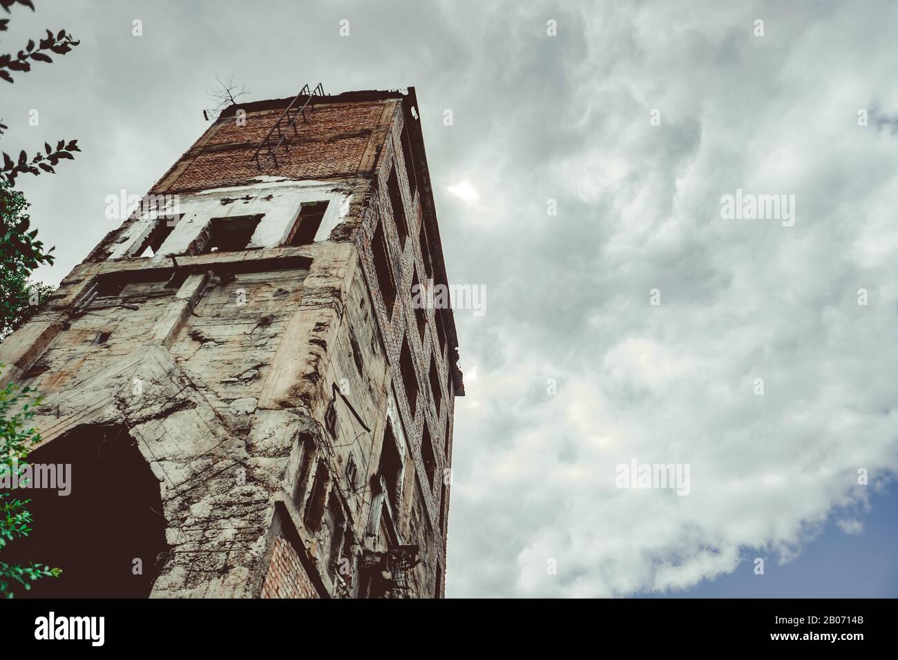 an old ruined building a tall tower against the sky Stock Photo - Alamy