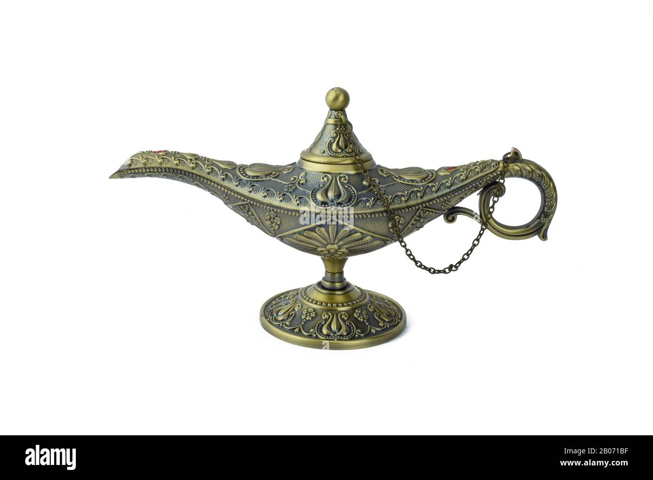 Side view of Aladdin's magical golden colored genie lamp isolated on a ...