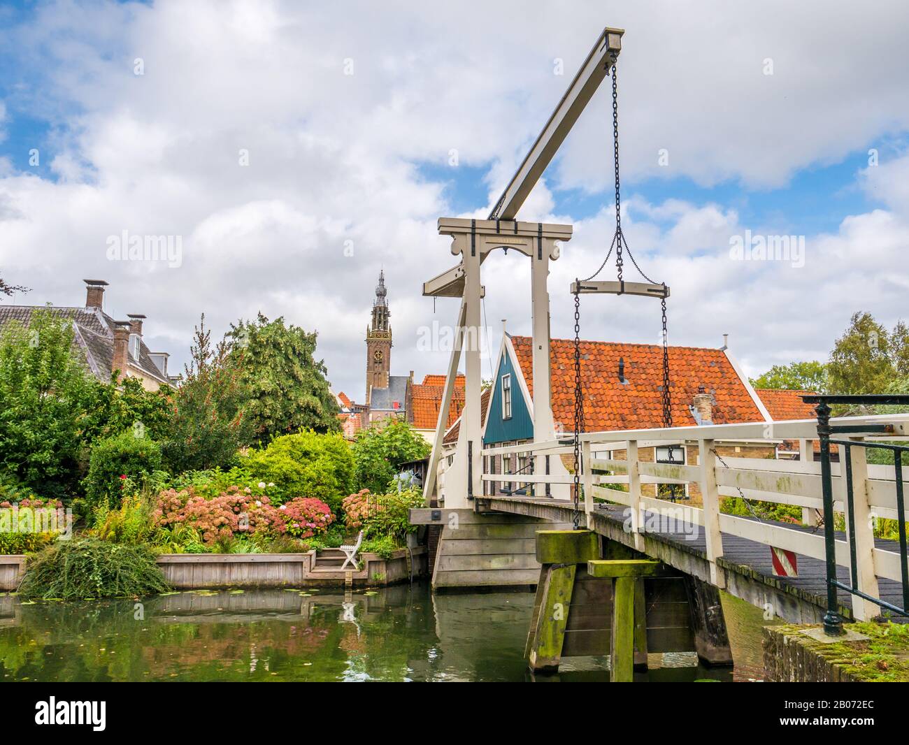 Draw bridge Kwakelbrug over canal and bell tower in Edam, Noord-Holland ...