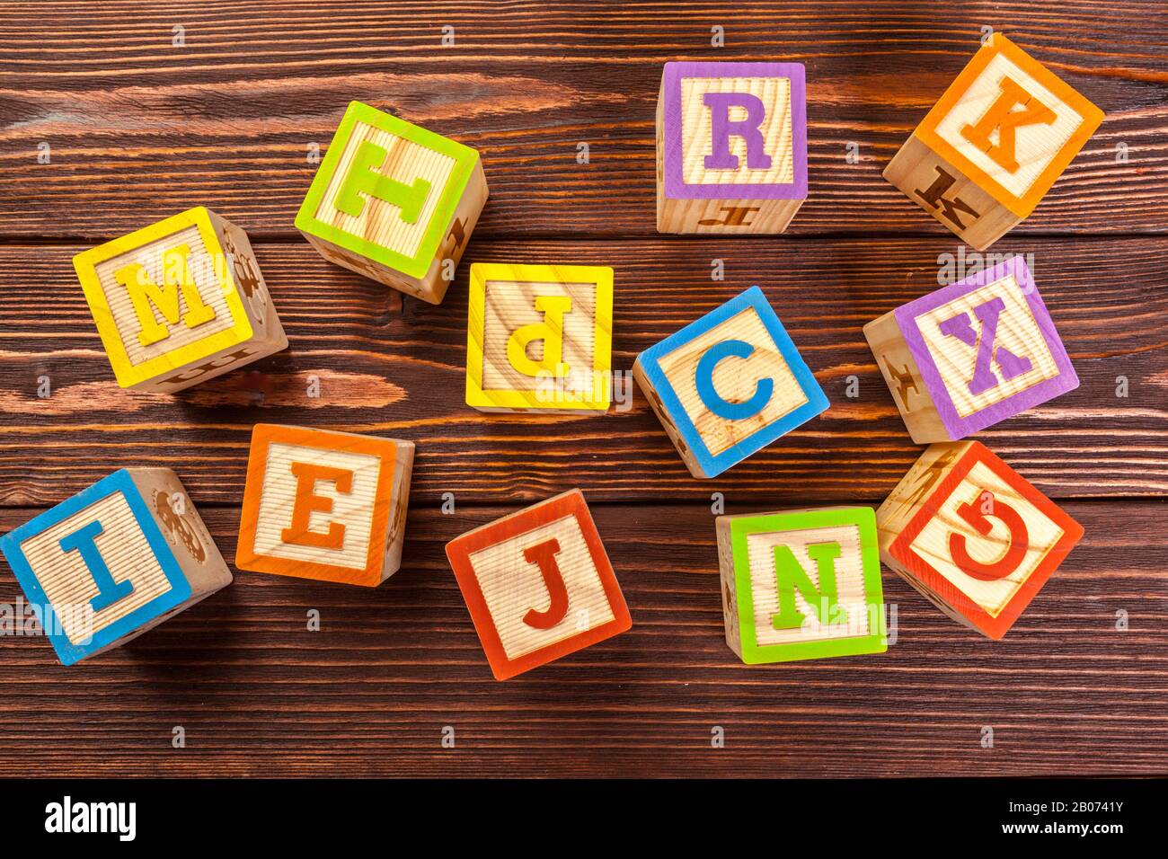 wooden block alphabet lay on wooden floor Stock Photo - Alamy