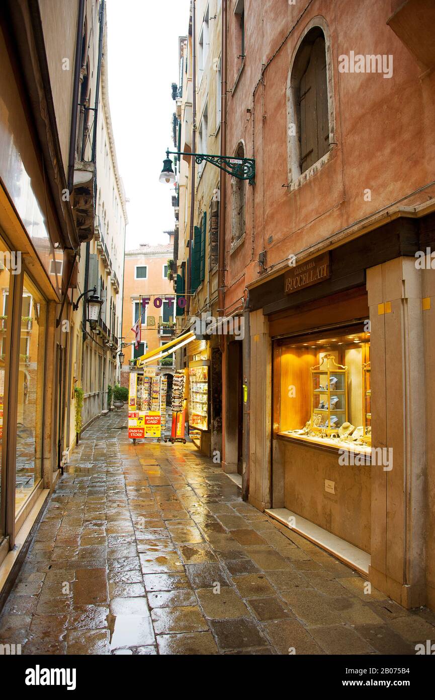 City of Venice, Italy, Europe. Shopping street in Venice with no tourists. Wet pavement Stock ...