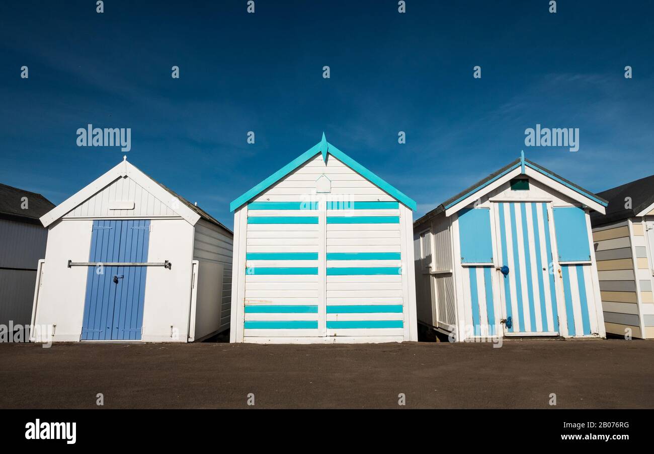 Traditional English Beach Huts. A row of beach huts commonly found in ...