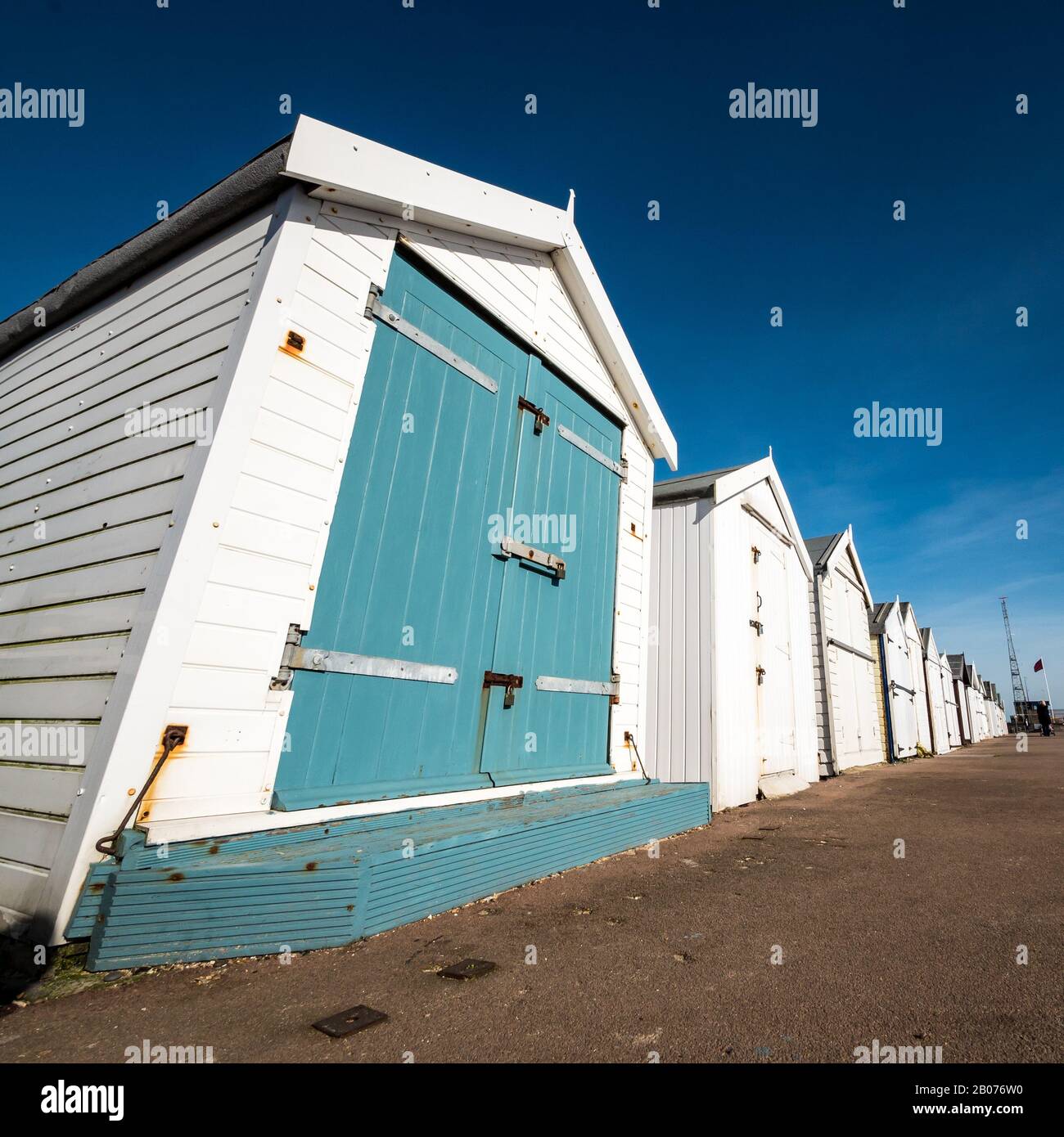 Traditional English Beach Huts. A row of beach huts commonly found in ...