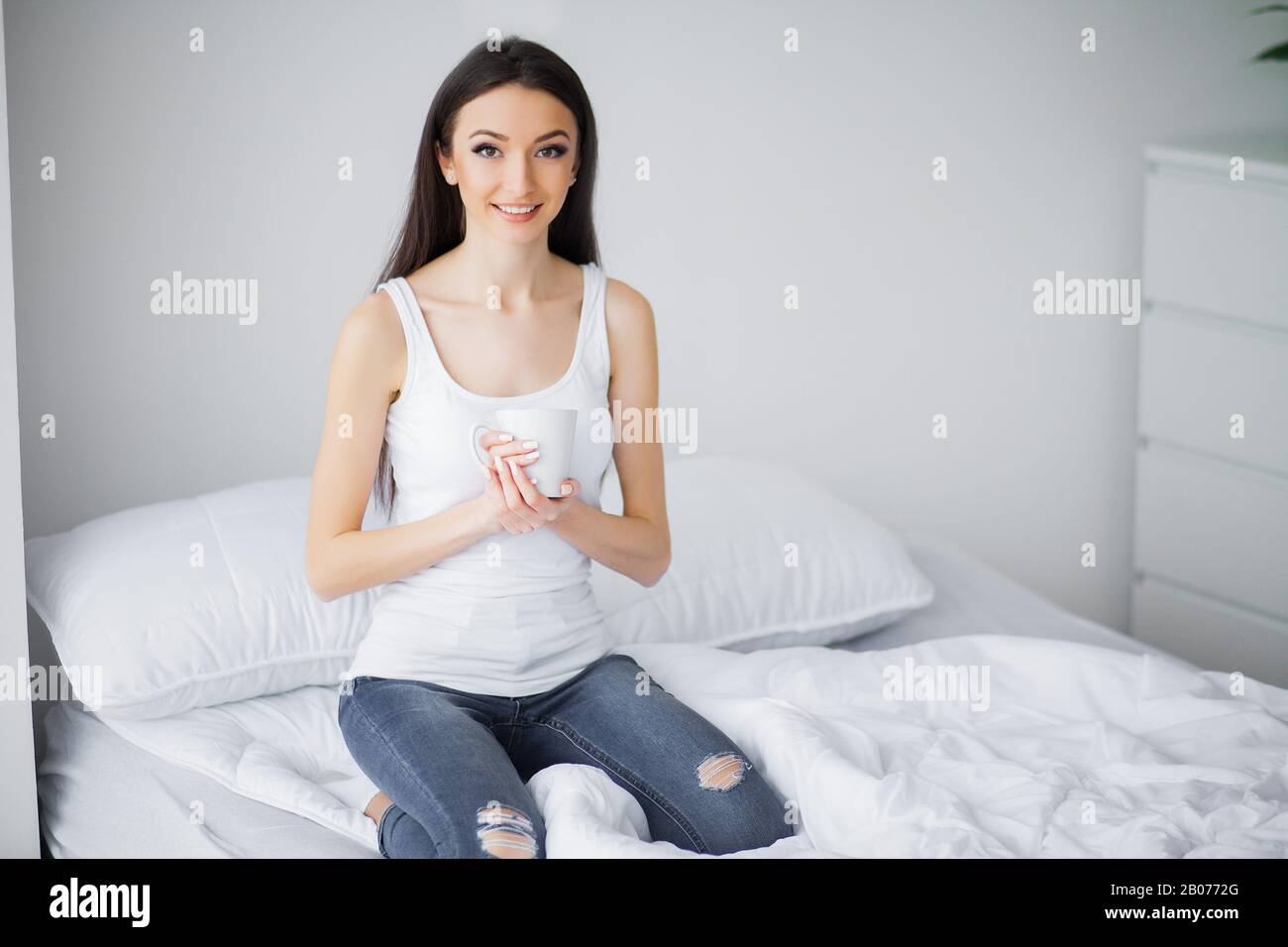 Good morning. Portrait of a smiling pretty young brunette woman ...