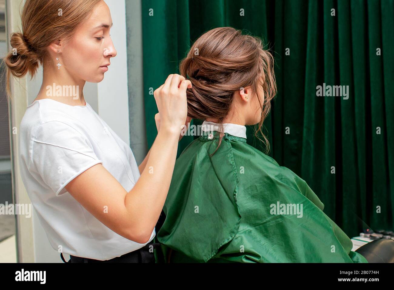 Happy woman stylist making hairdo hi-res stock photography and images ...