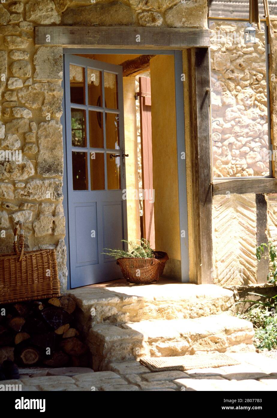 Open door to country house Stock Photo - Alamy