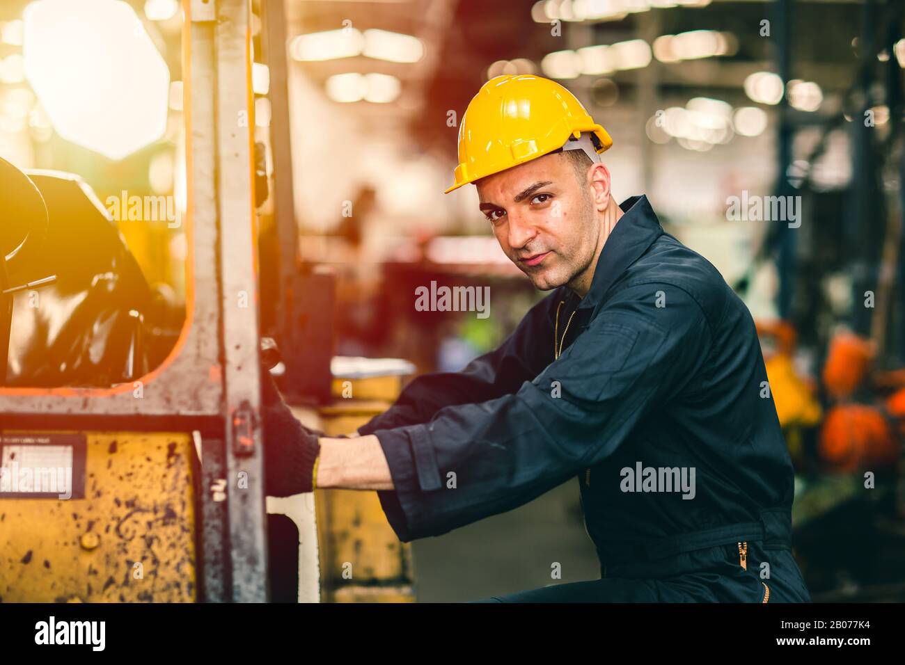 Portrait of Caucasian factory worker handsome smart with safety clothes ...