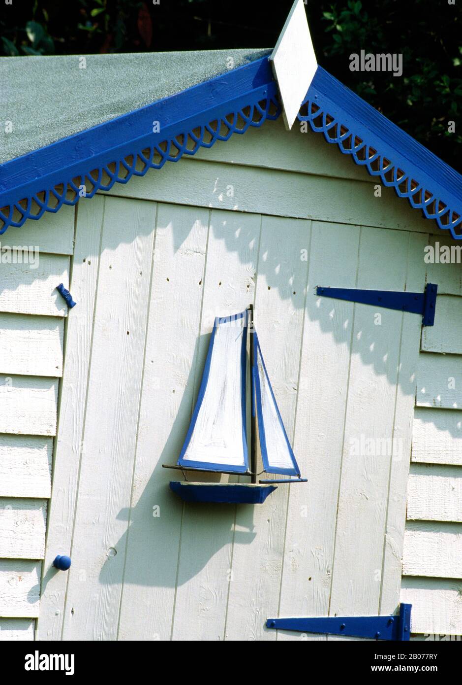 Blue and white painted shed Stock Photo - Alamy