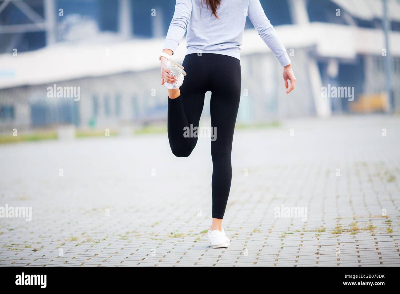 Fitness. Athletic women posing and stretching before run Stock Photo ...