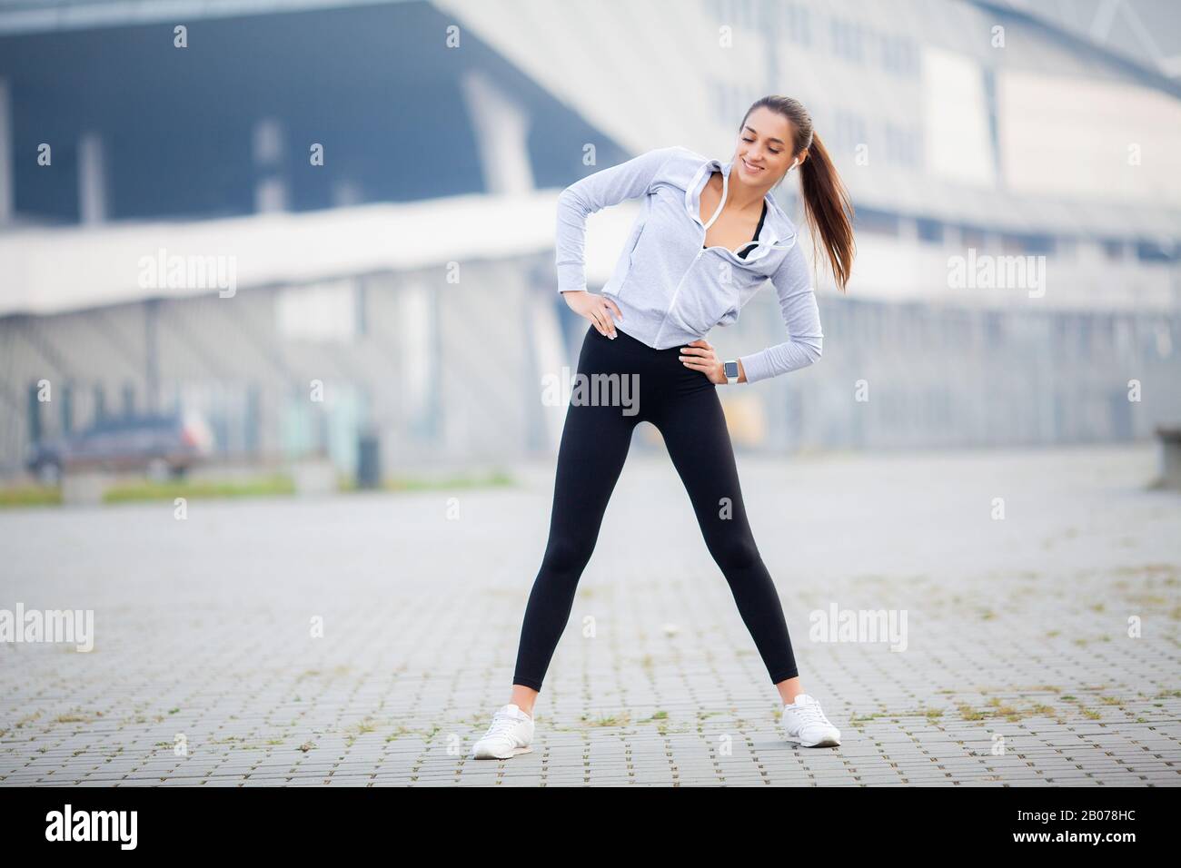 Fitness. Athletic women posing and stretching before run Stock Photo ...