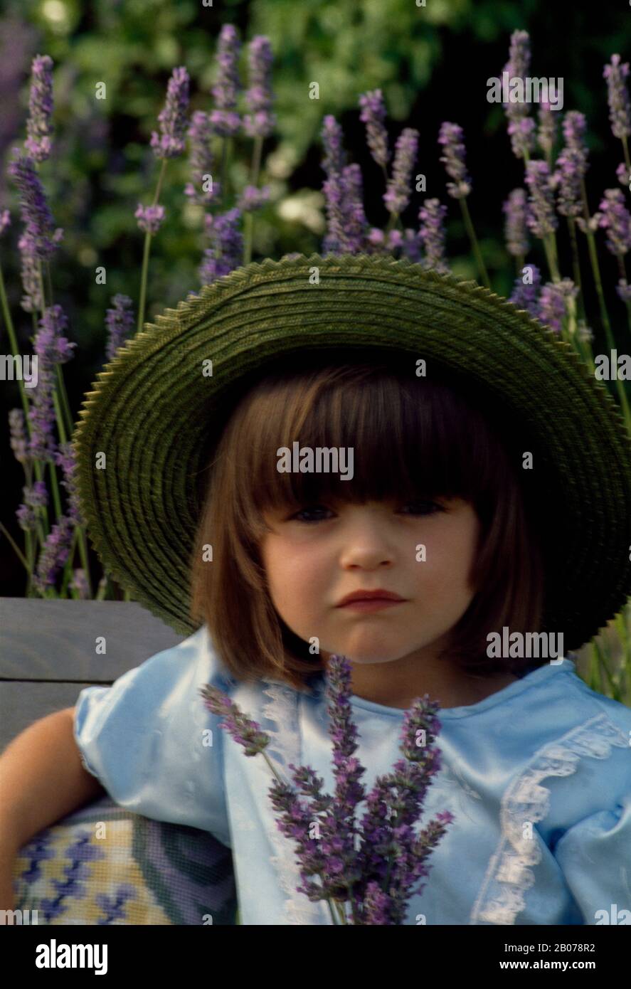 Girl in blue dress and hat hi-res stock photography and images - Alamy
