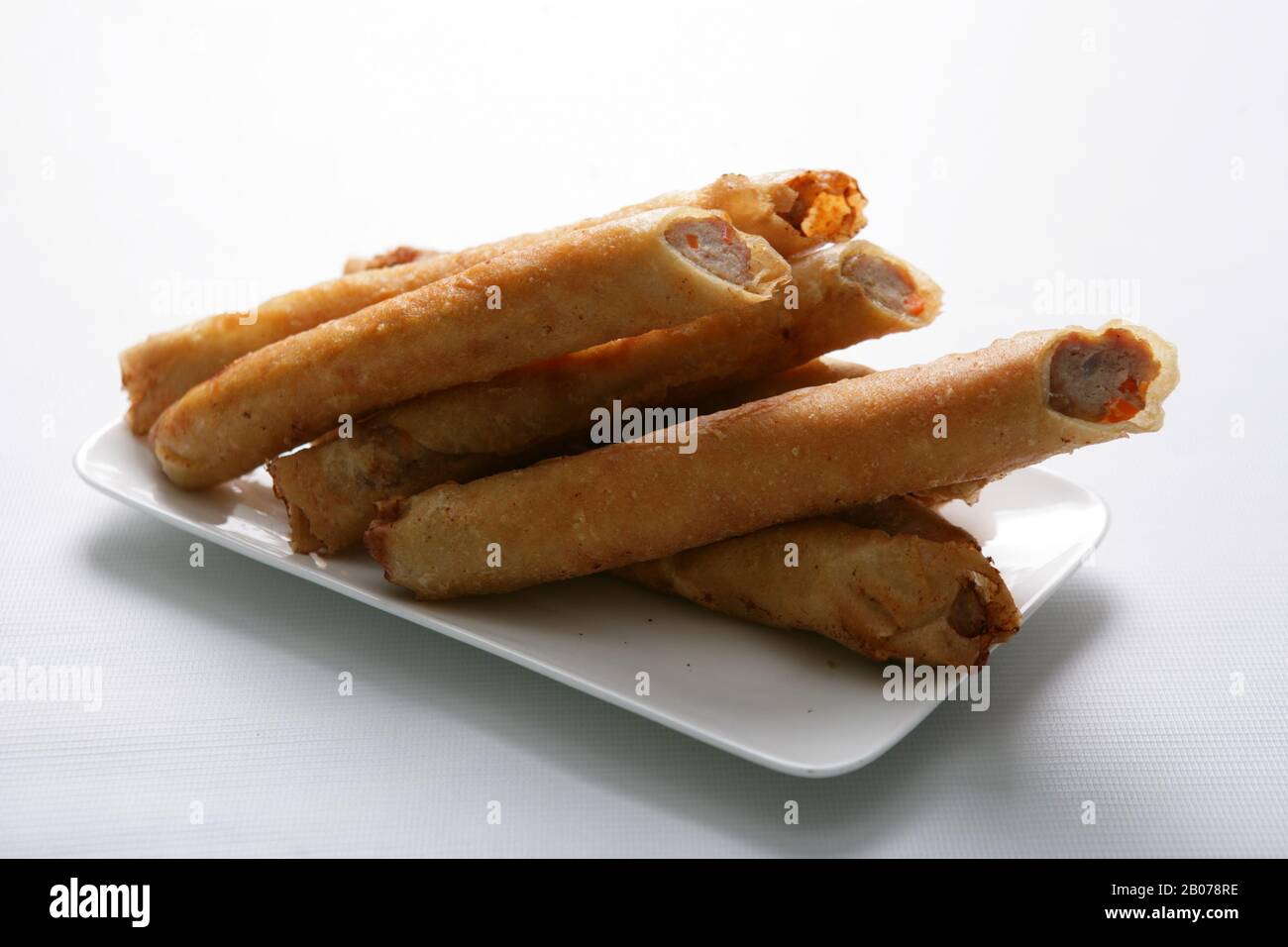 Lumpiang shanghai in white background Stock Photo - Alamy
