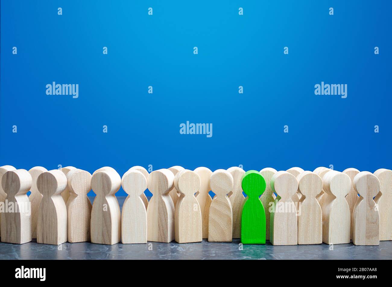 A green man stands out from the crowd. Talented and skillful suitable ...