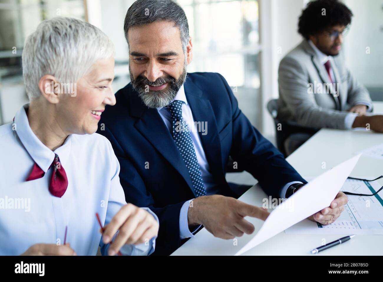 Business people discussing together in hi-res stock photography and ...