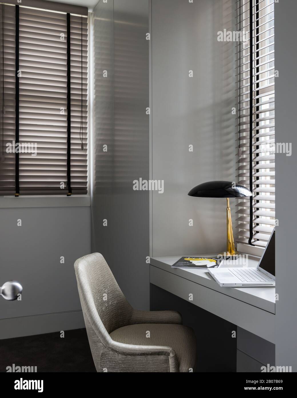 Gray office with recessed desk Stock Photo - Alamy