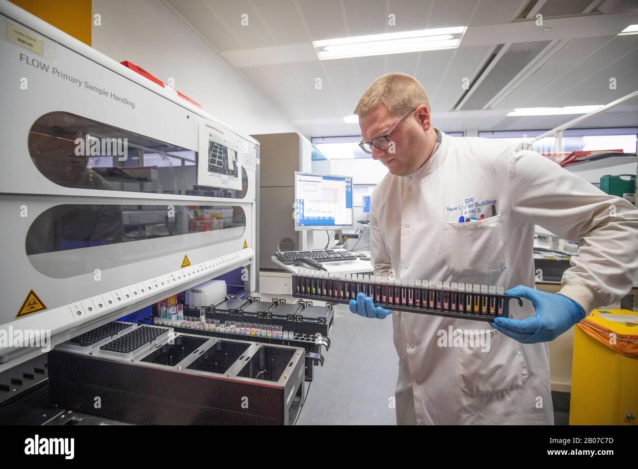 Clinical support technician Douglas Condie extracts viruses from swab ...