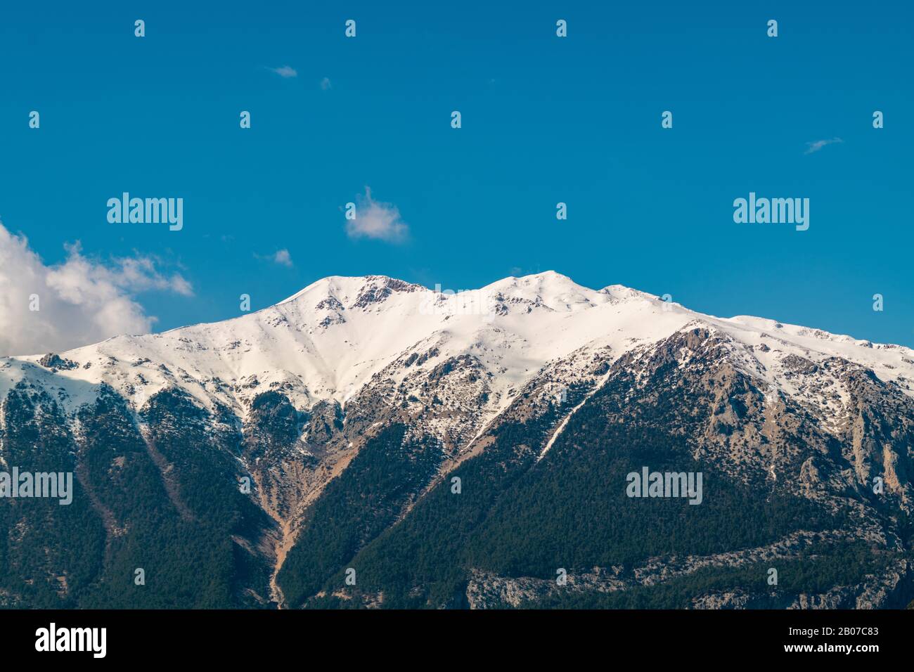 Snowy mountain range on cold clear winter day Stock Photo - Alamy