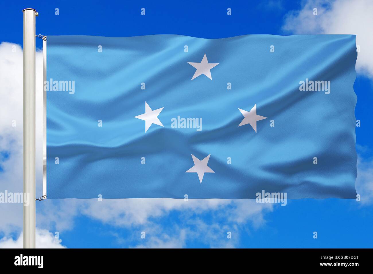 flag of the Federated States of Micronesia in front of blue cloudy sky ...