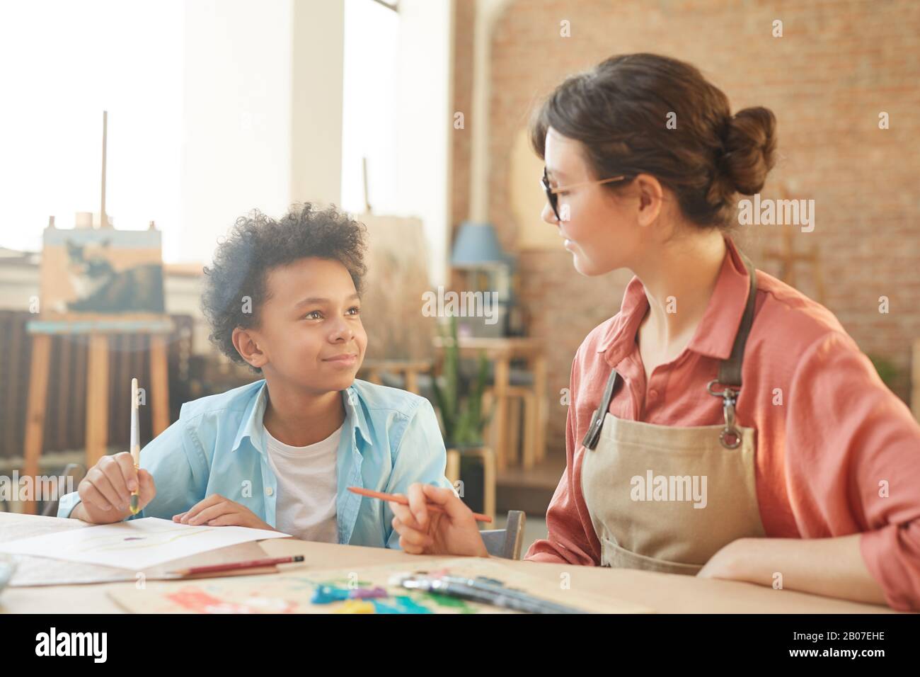 Two boys talking classroom hi-res stock photography and images - Alamy