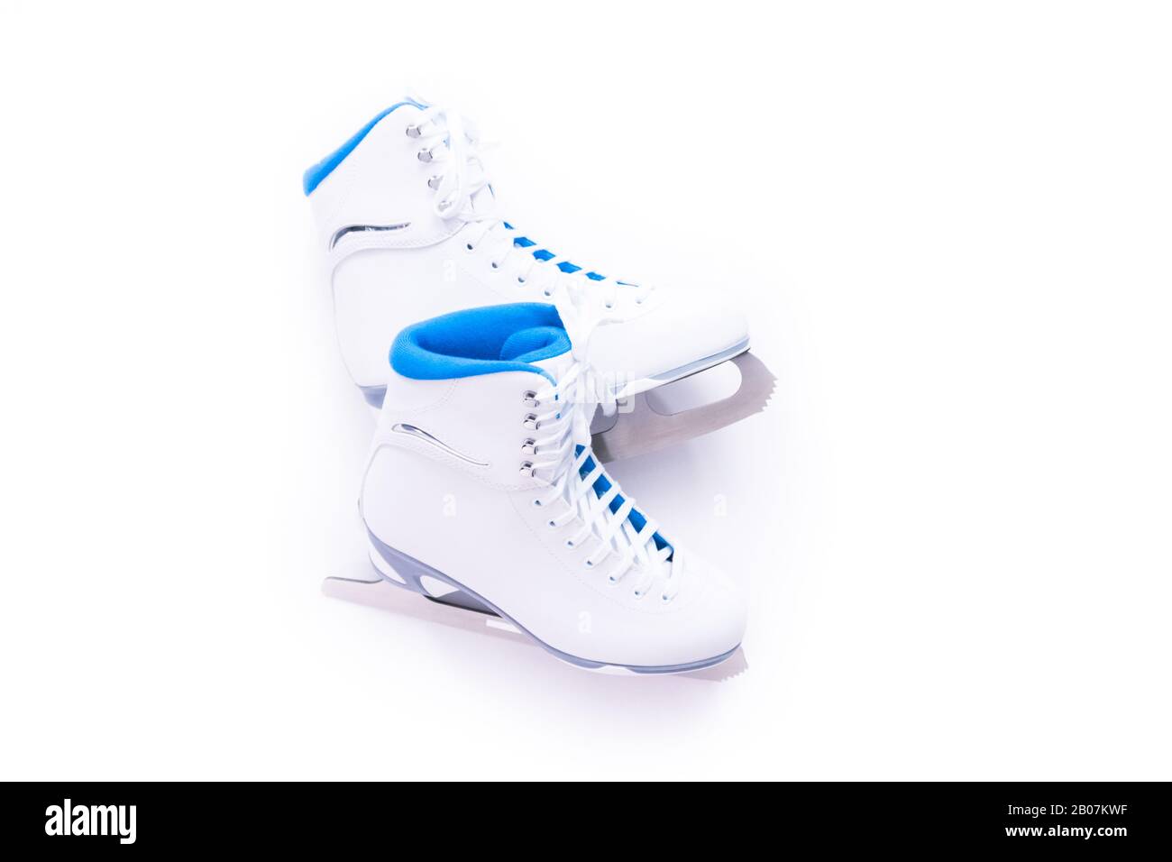 Flat lay. New white figure skates on a white background Stock Photo - Alamy