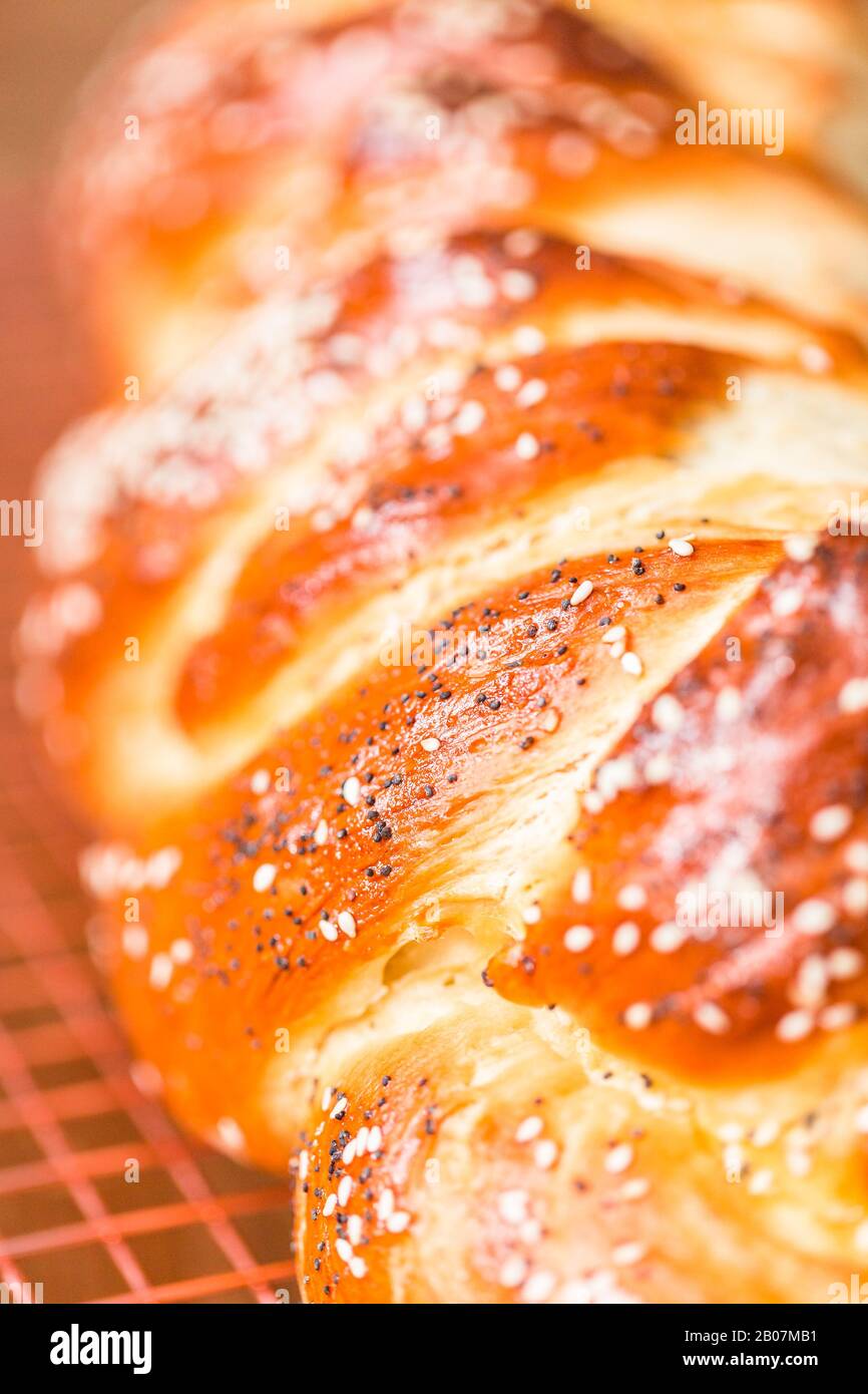 Close up of braided challah bread with sesame and poppy seeds Stock ...