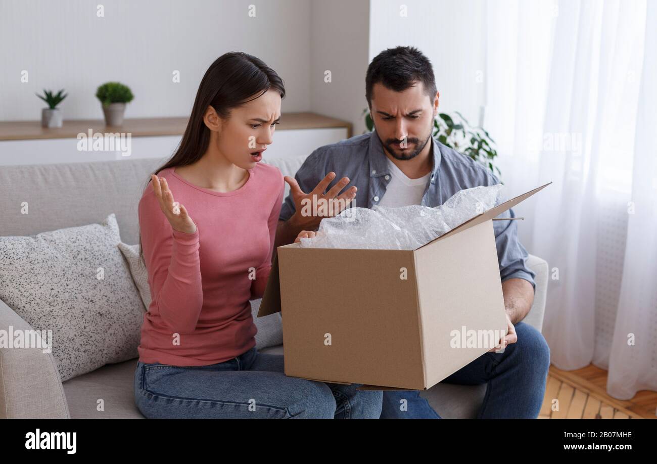 Man opening box disappointed hi-res stock photography and images - Alamy
