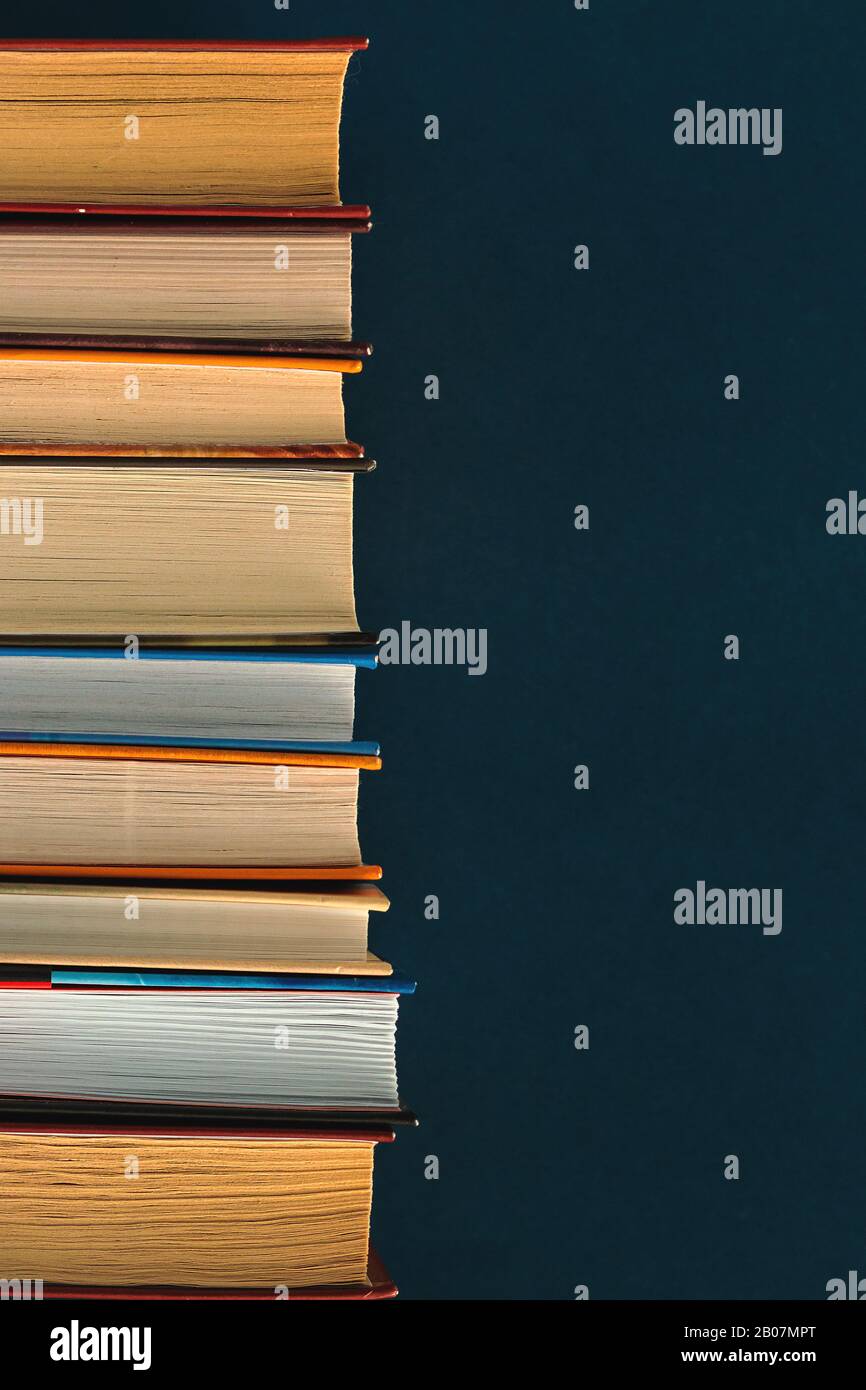 Stack of old books in a library , retro tone and grain noise, vintage ...
