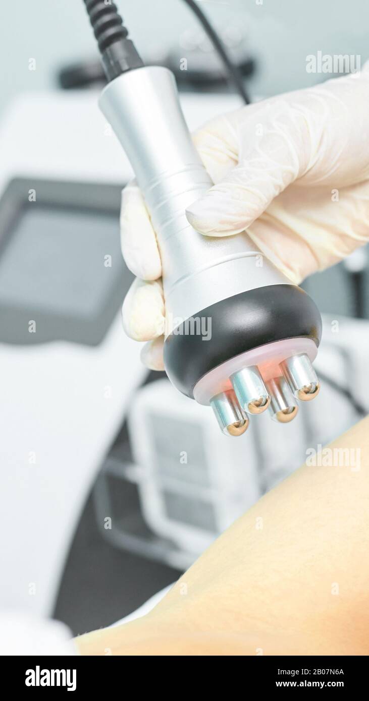 Perfect body radio treatment. Woman at spa procedure. Doctor hand and ...