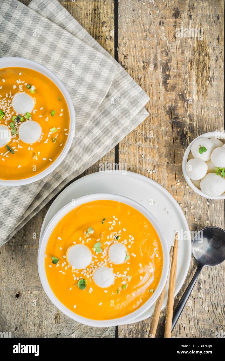 Hobak juk, korean traditional pumpkin porridge soup, with rice balls ...