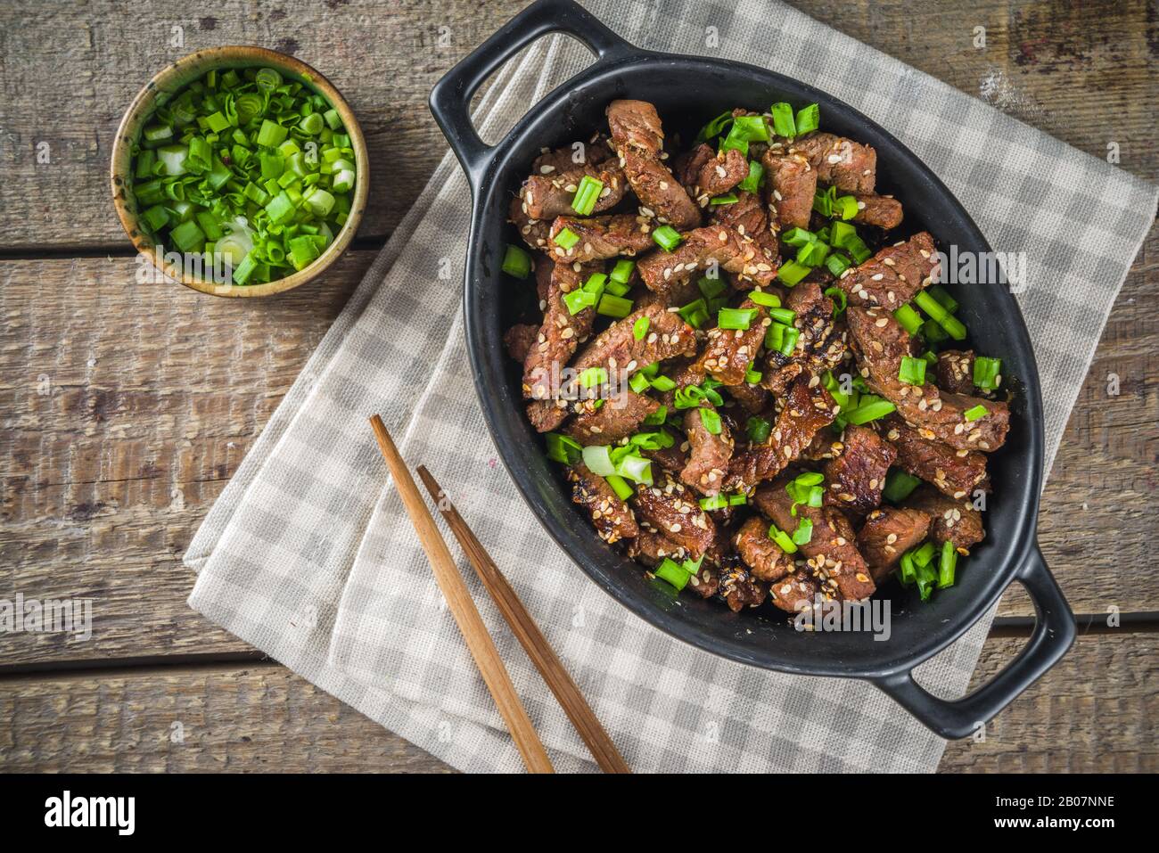 Korean BBQ dish Beef Bulgogi, with marinated rib eye beef meat slices ...
