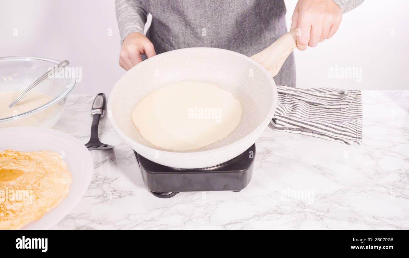 Making crepes in a small frying pan over medium heat Stock Photo - Alamy