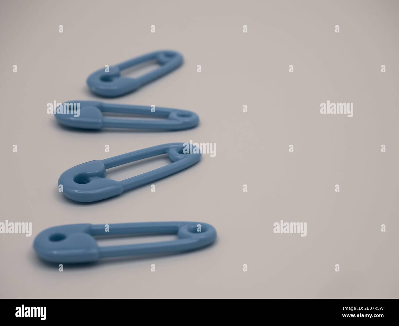 Blue safety pin for baby boy theme, on a white background Stock Photo ...