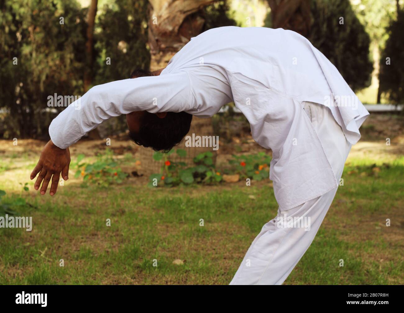 An Indian Yoga instructor showing Indian yoga asanas Stock Photo - Alamy