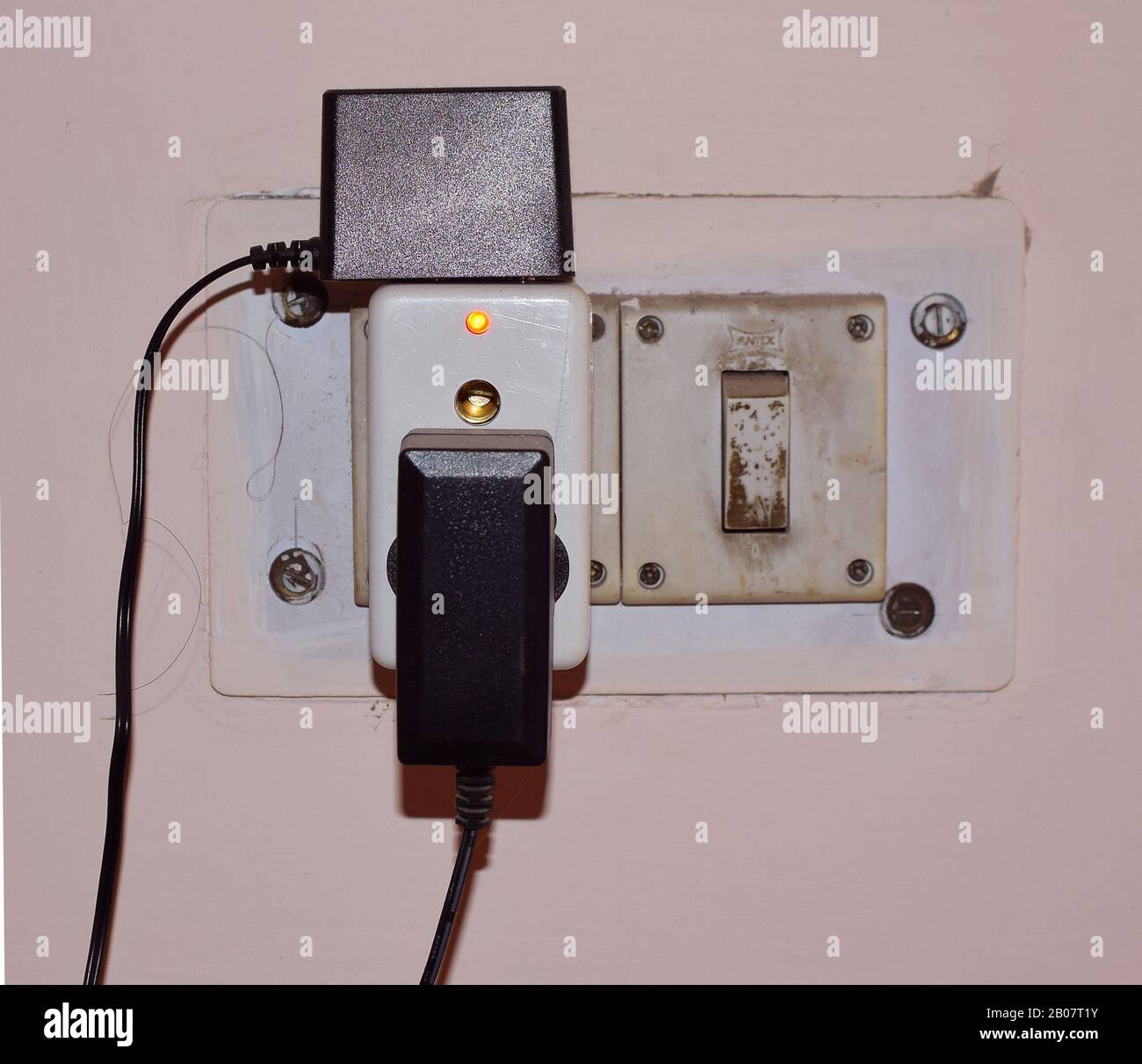An electrical point with multiple plug options (Three pin plug Stock ...