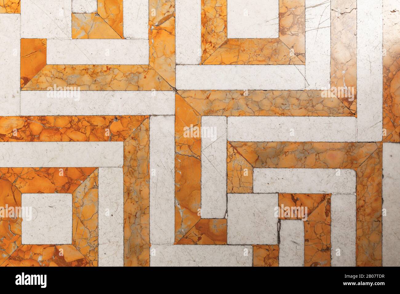 Vintage yellow white stone mosaic floor tiling with geometric pattern ...