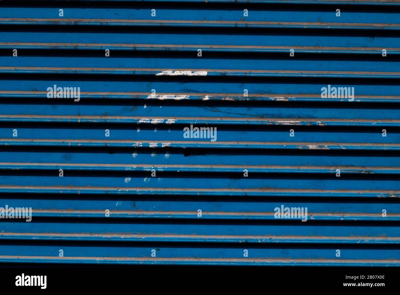 metal shutter on a locked up shop with spray paint Stock Photo - Alamy
