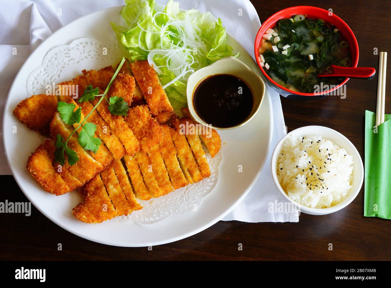 A plate of sliced fried chicken katsu at a Japanese restaurant Stock ...