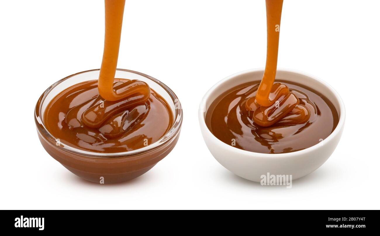 Pouring caramel sauce isolated on white background Stock Photo - Alamy