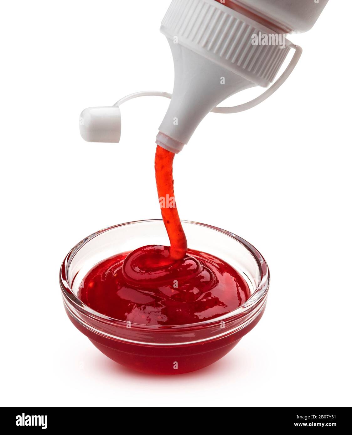 Pouring red berry jam isolated on white background Stock Photo - Alamy